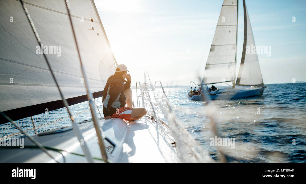 Young man relaxing on sail boat hi-res stock photography and images - Alamy