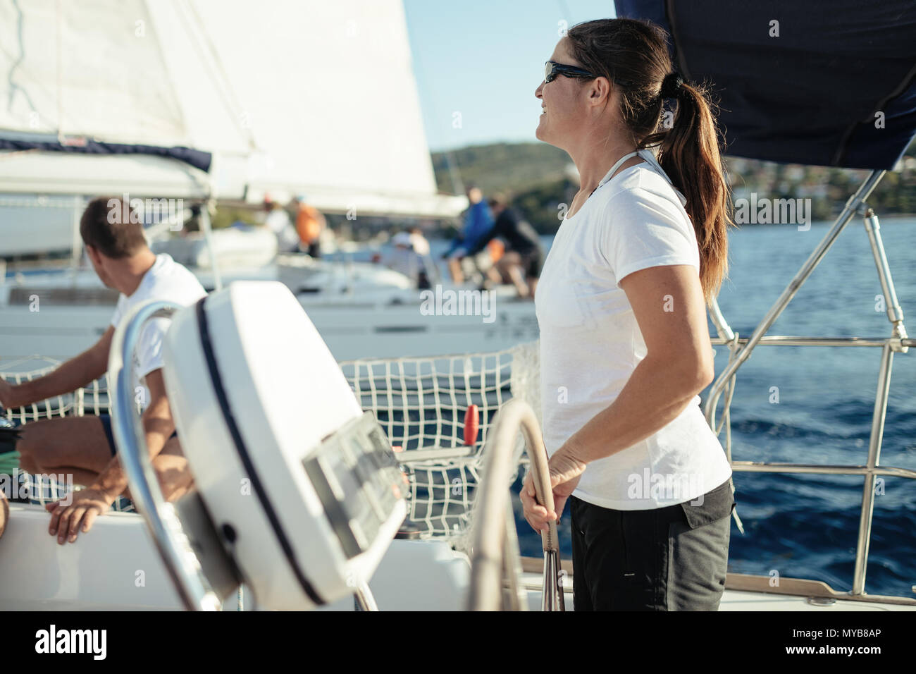 Woman enjoying relaxing sailing boat hi-res stock photography and ...