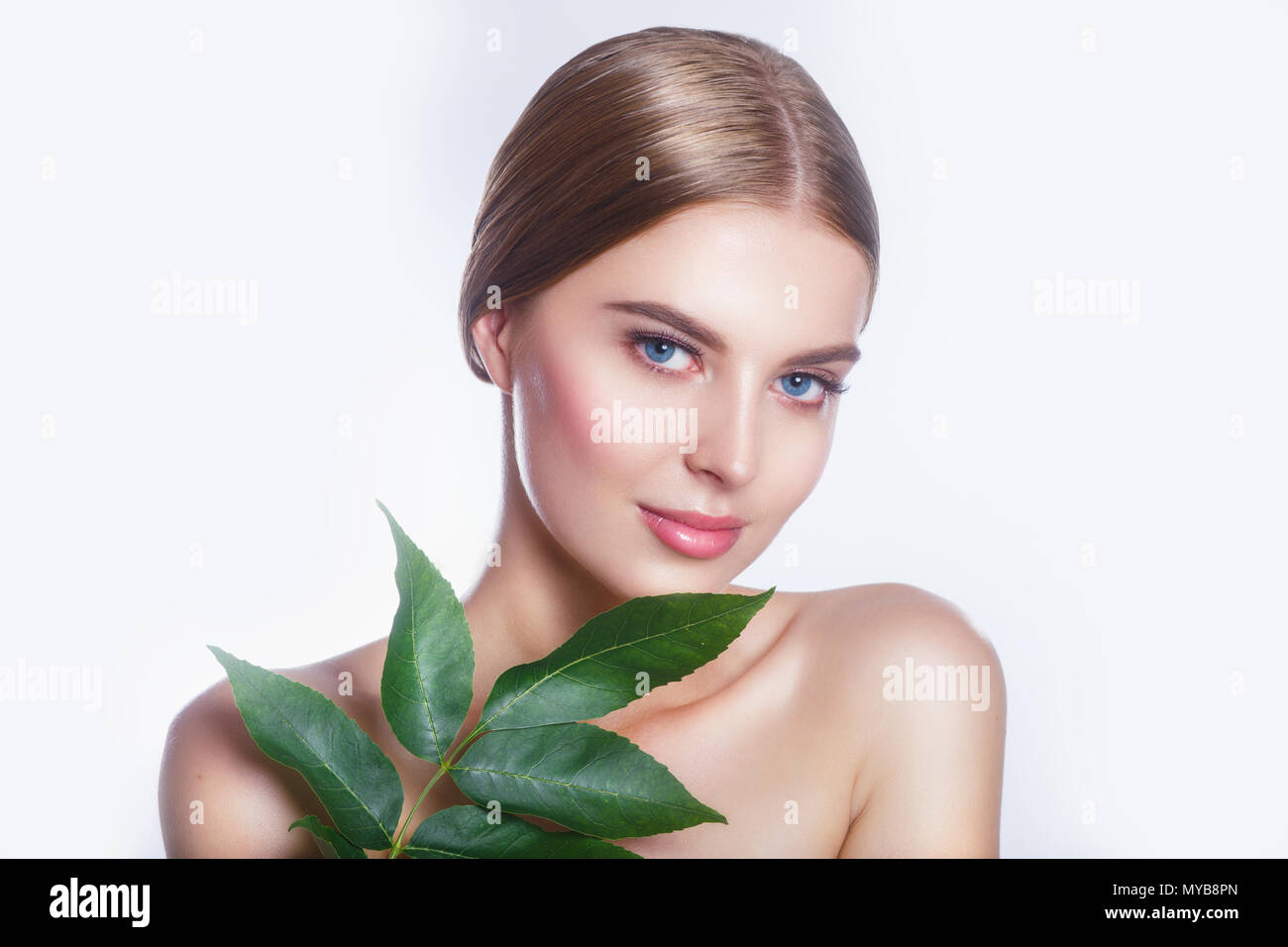 Beautiful Woman Face Portrait With Green Leaf Concept For Skin Care Or