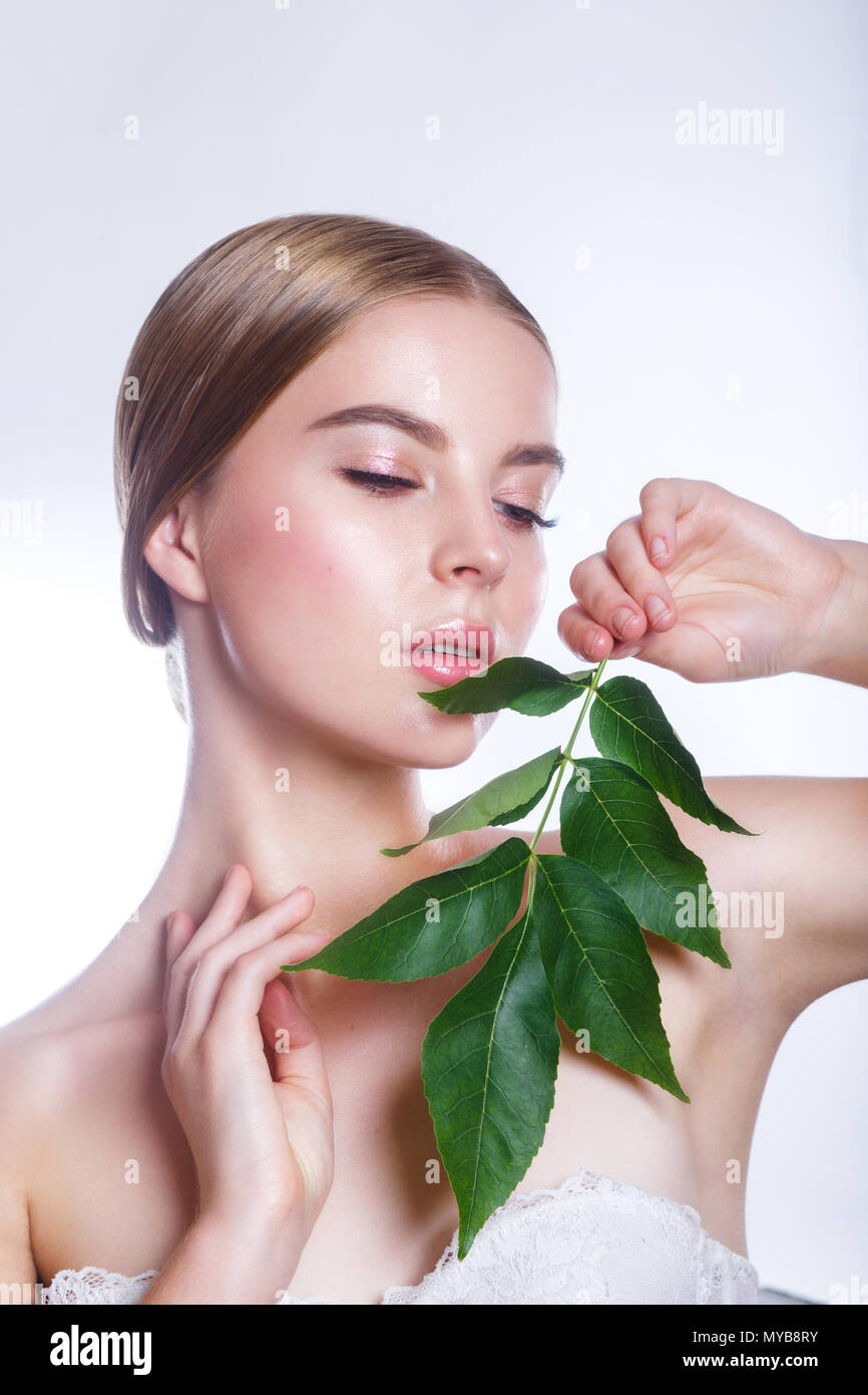 Beautiful Woman Face Portrait With Green Leaf Concept For Skin Care Or