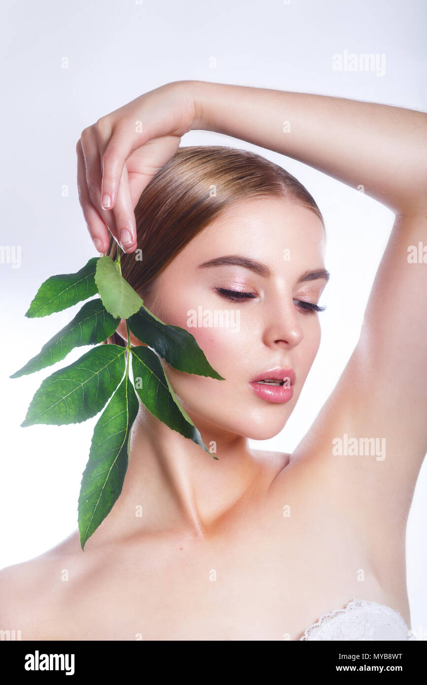 Beautiful Woman Face Portrait With Green Leaf Concept For Skin Care Or