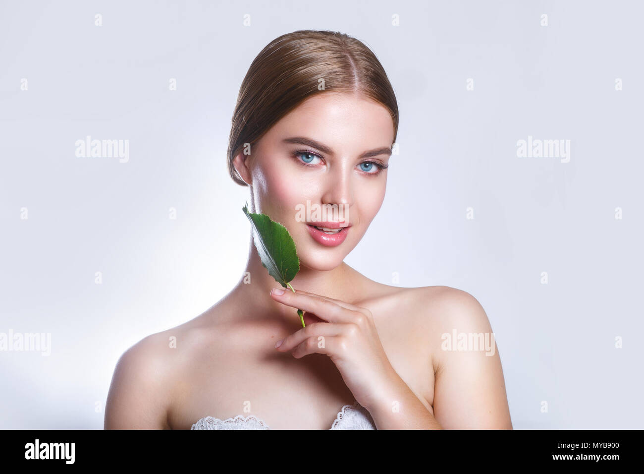 Beautiful Woman Face Portrait With Green Leaf Concept For Skin Care Or
