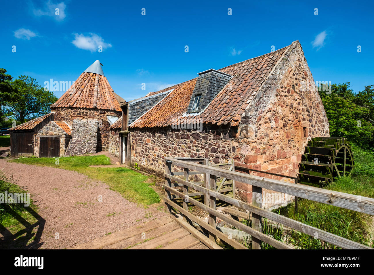 View of Preston Mill with waterwheel, millpond and doocot on River Tyne ...