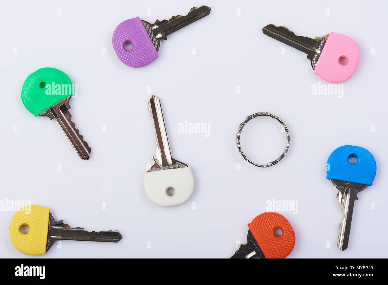 Colorful pattern of metal keys with white background Stock Photo - Alamy
