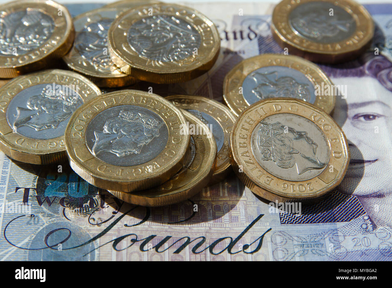 Coins on a banknote as a financial concept signifying prosperity or ...