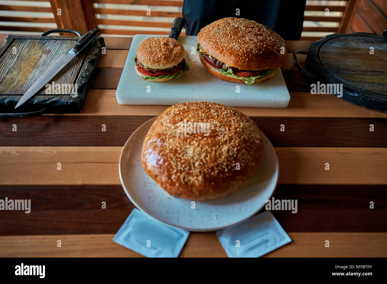 big juicy Burger on the table Stock Photo - Alamy