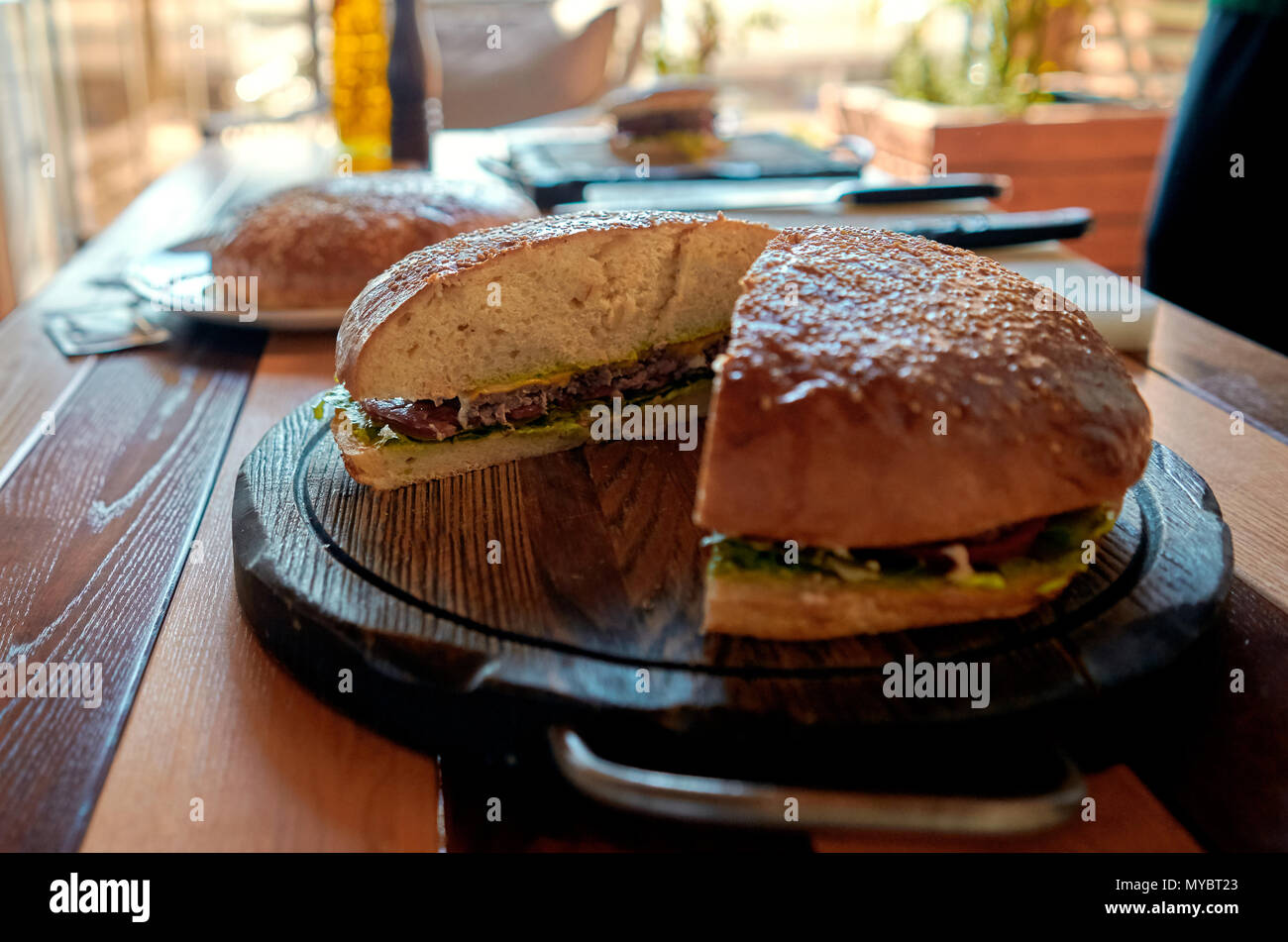 Big burger on restaurant hi-res stock photography and images - Alamy