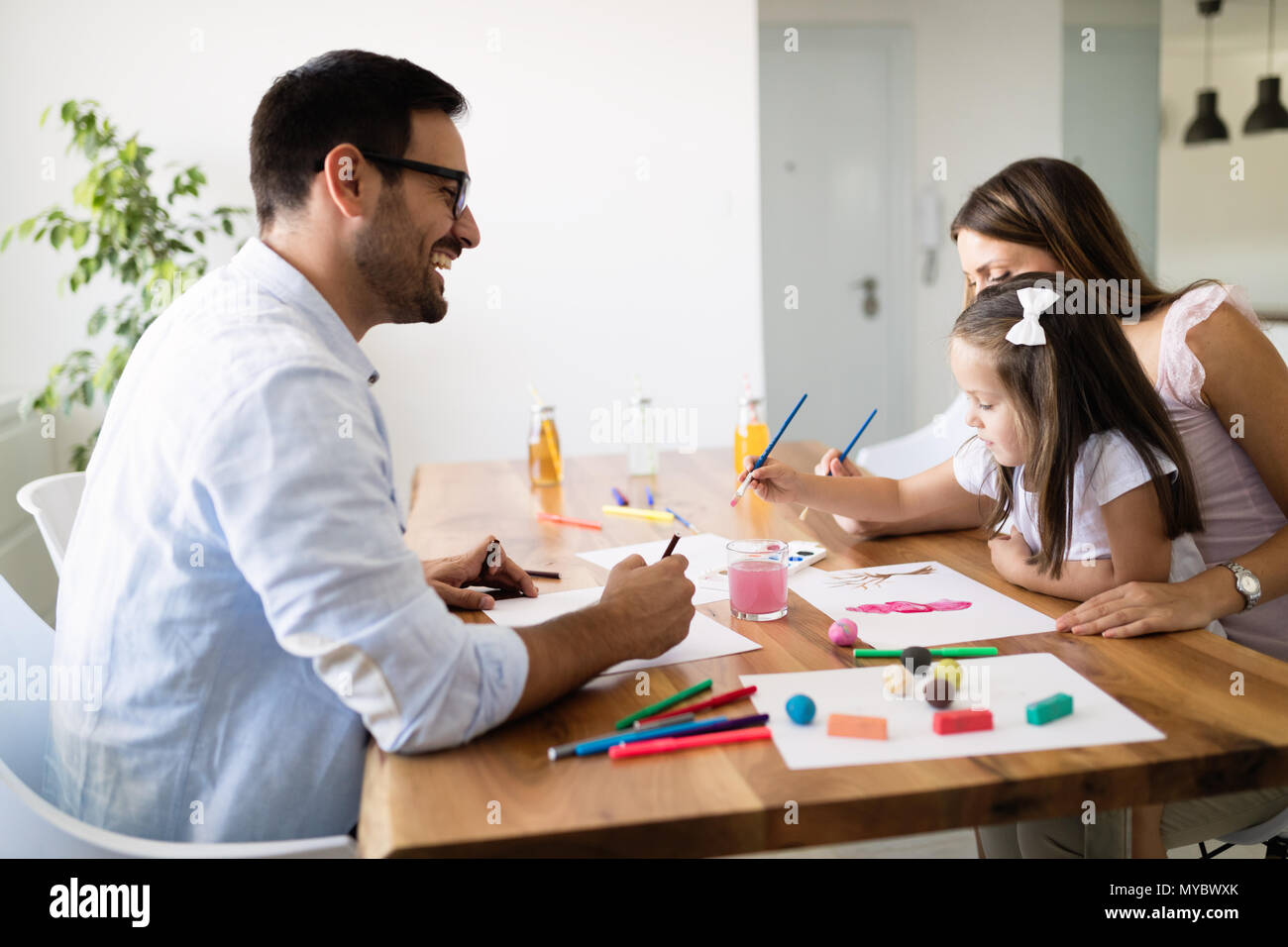 Happy family having fun time at home Stock Photo - Alamy