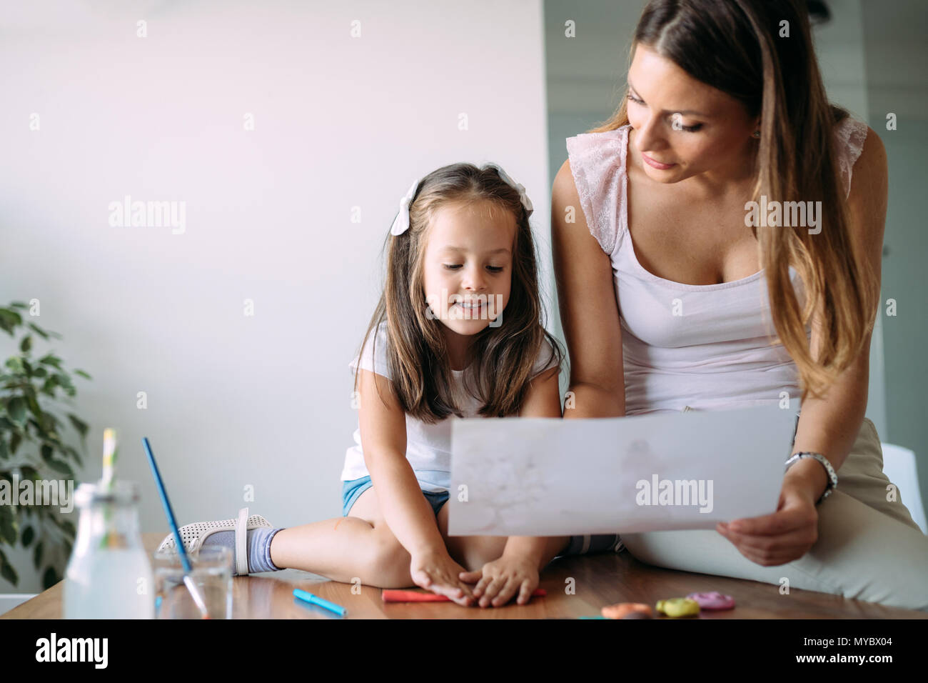 Happy family having fun time at home Stock Photo - Alamy