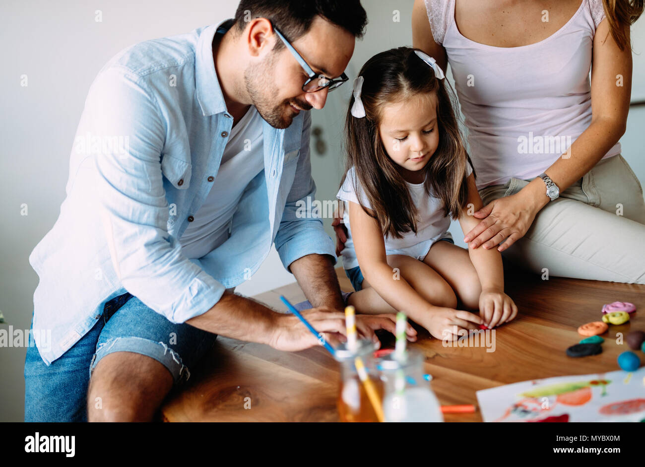 Happy family having fun time at home Stock Photo - Alamy