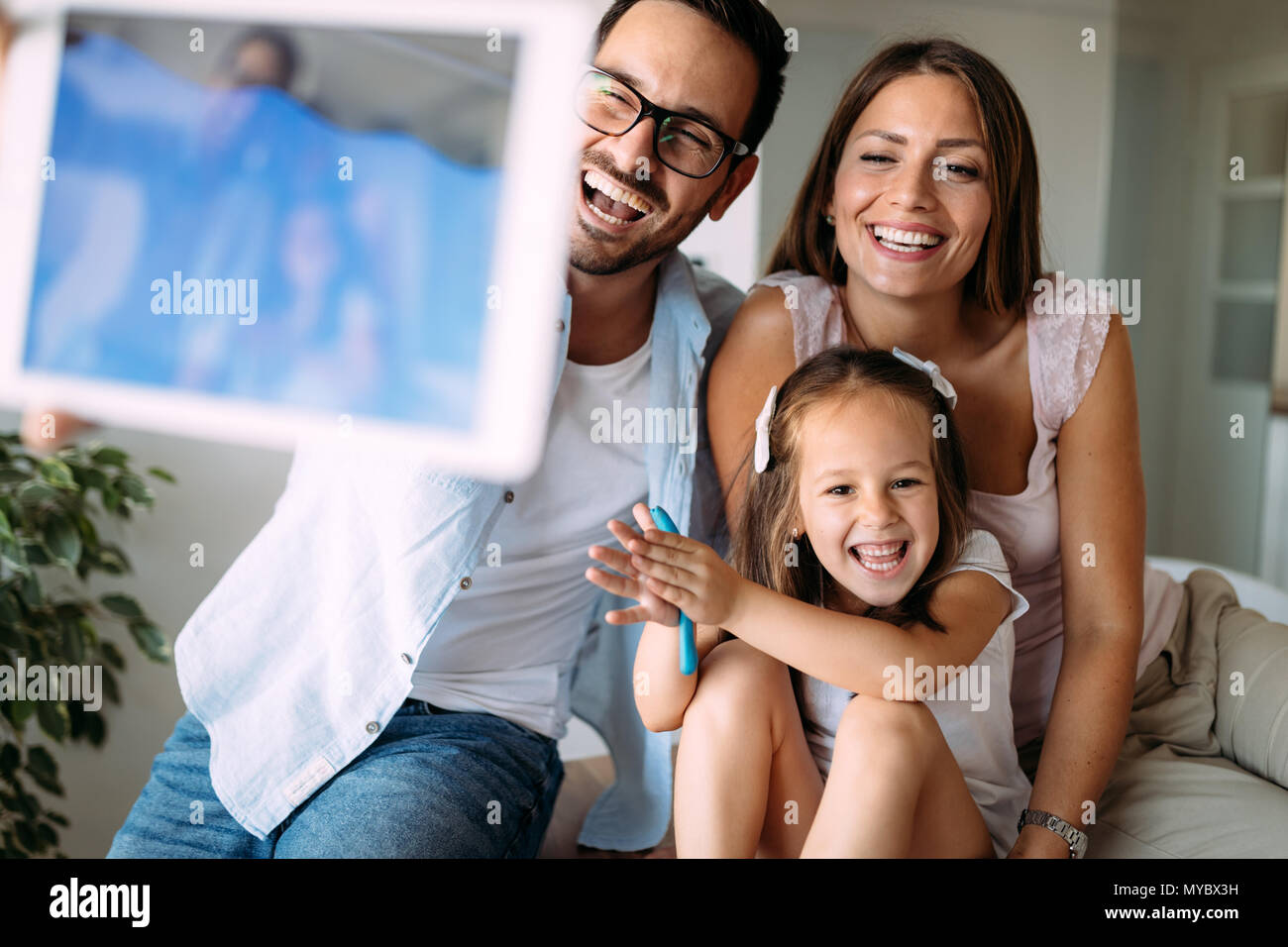 Happy family having fun time at home Stock Photo - Alamy