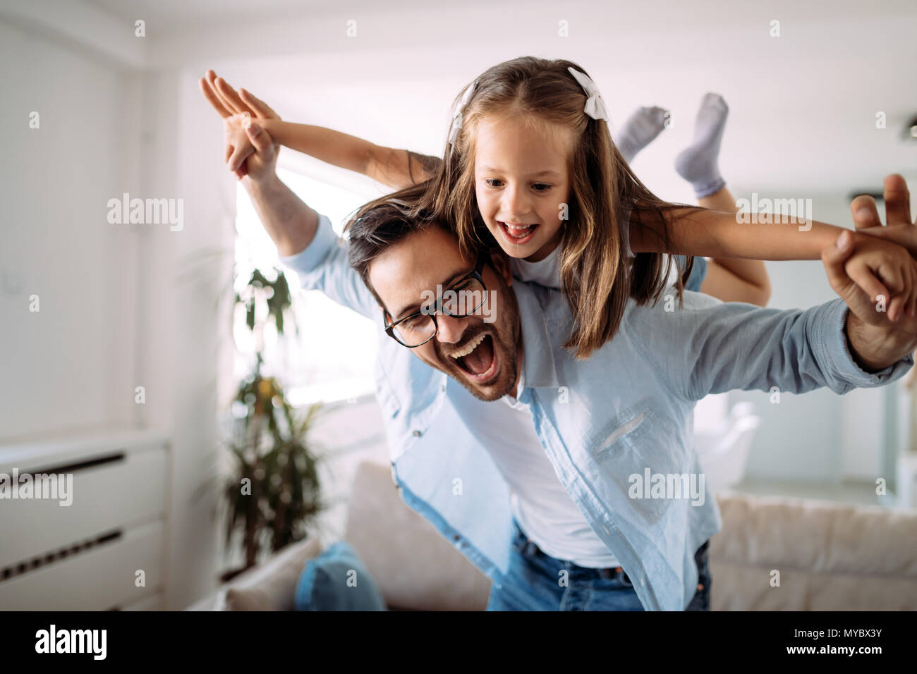 Happy family having fun time at home Stock Photo - Alamy