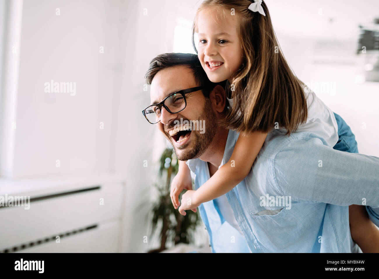 Happy family having fun time at home Stock Photo - Alamy