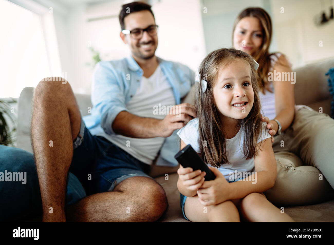 Happy family having fun time at home Stock Photo - Alamy