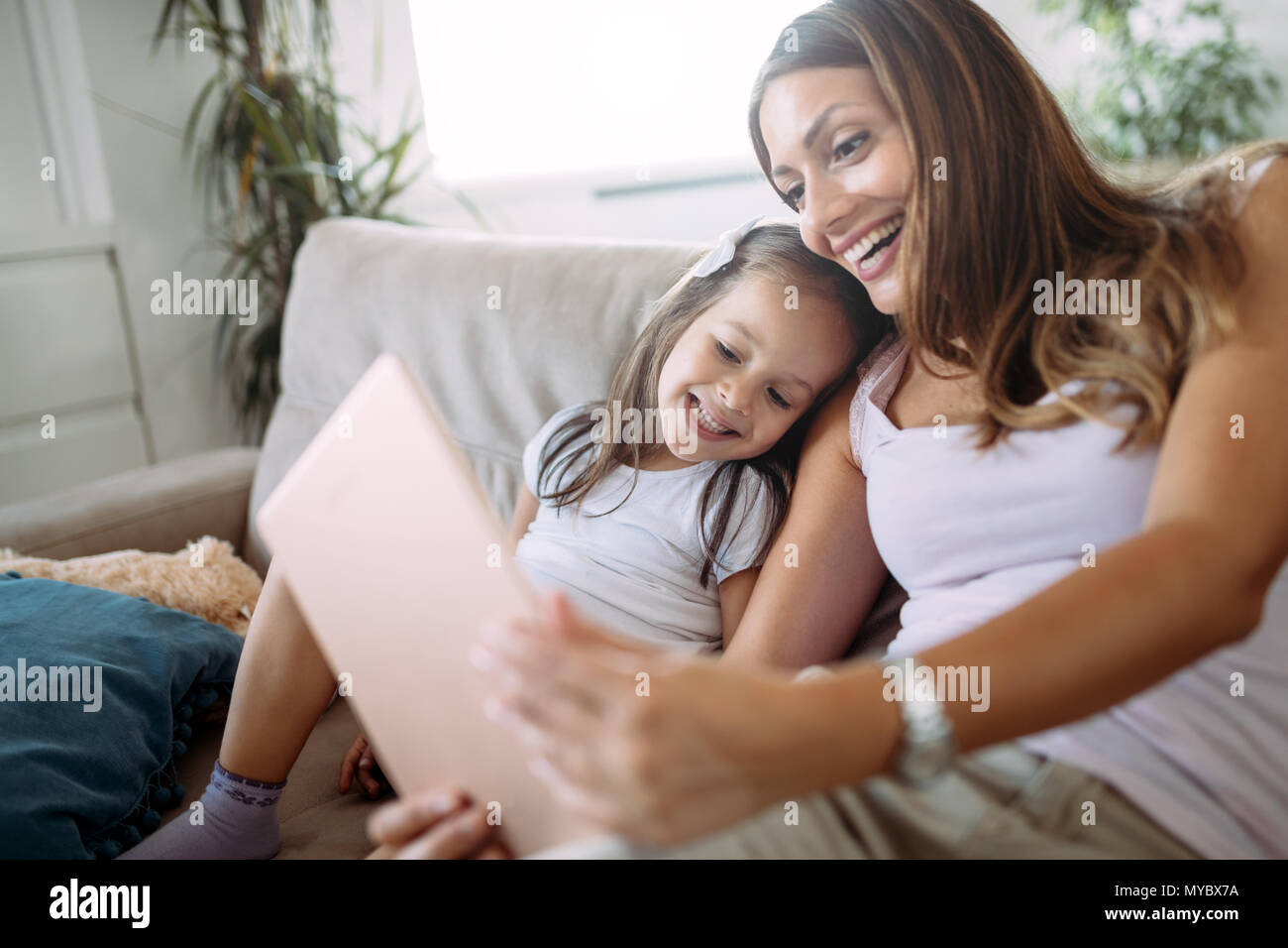 Happy family having fun time at home Stock Photo - Alamy