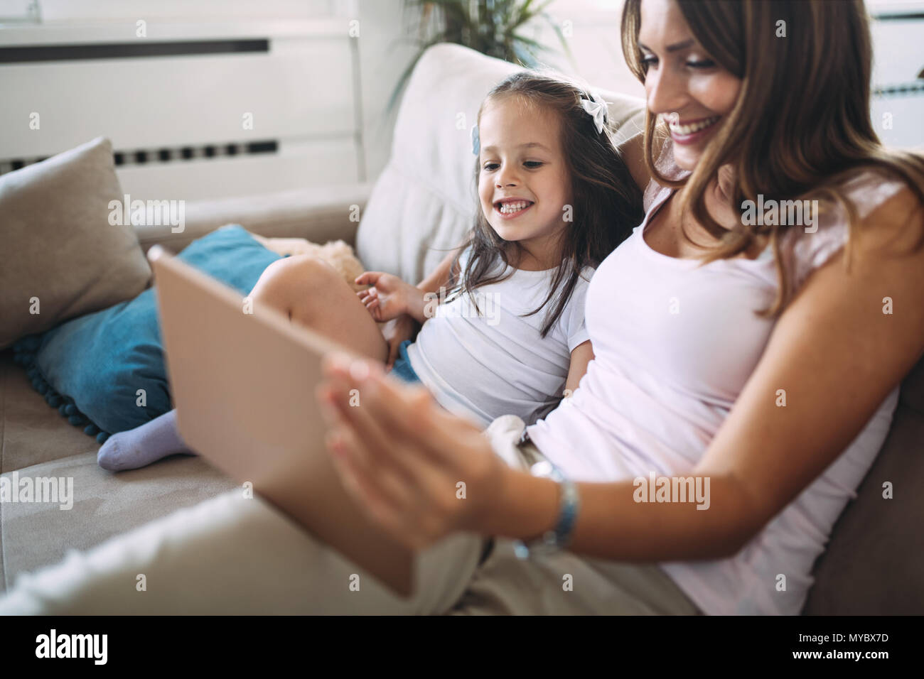Happy family having fun time at home Stock Photo - Alamy