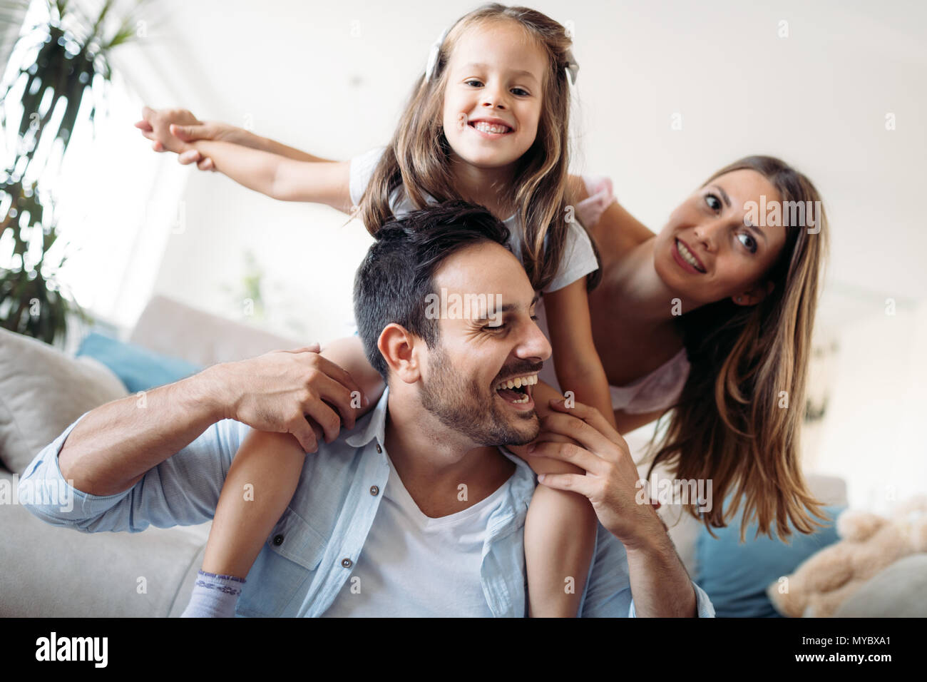 Happy family having fun time at home Stock Photo - Alamy