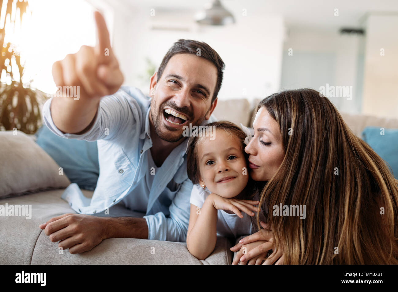 Happy family having fun time at home Stock Photo - Alamy