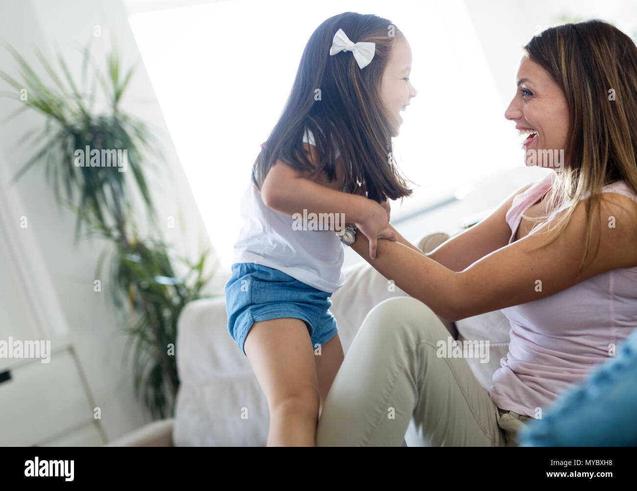 Happy family having fun time at home Stock Photo - Alamy