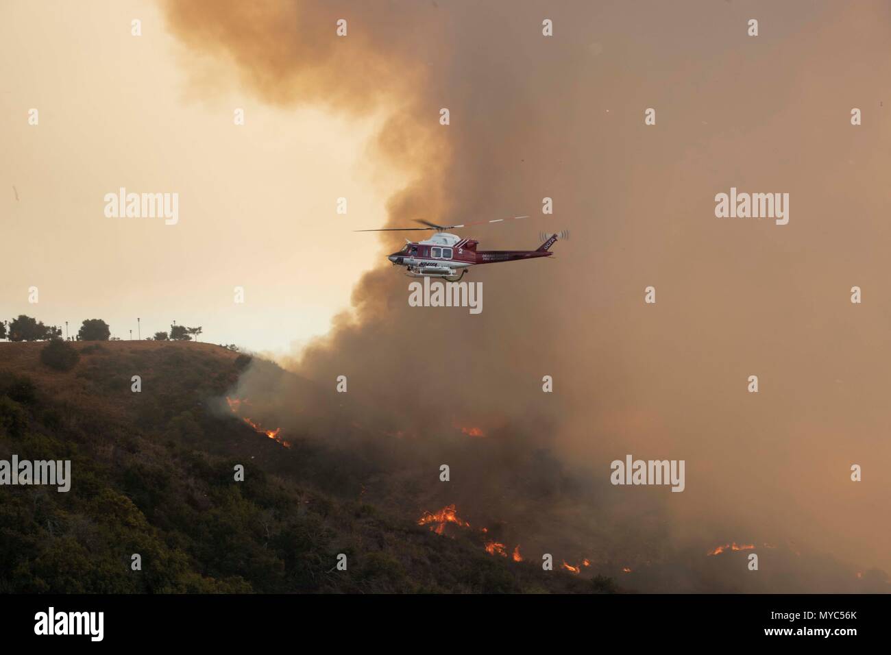 OCFA fire helicopter flies through smoke to help fight the Aliso Viejo ...