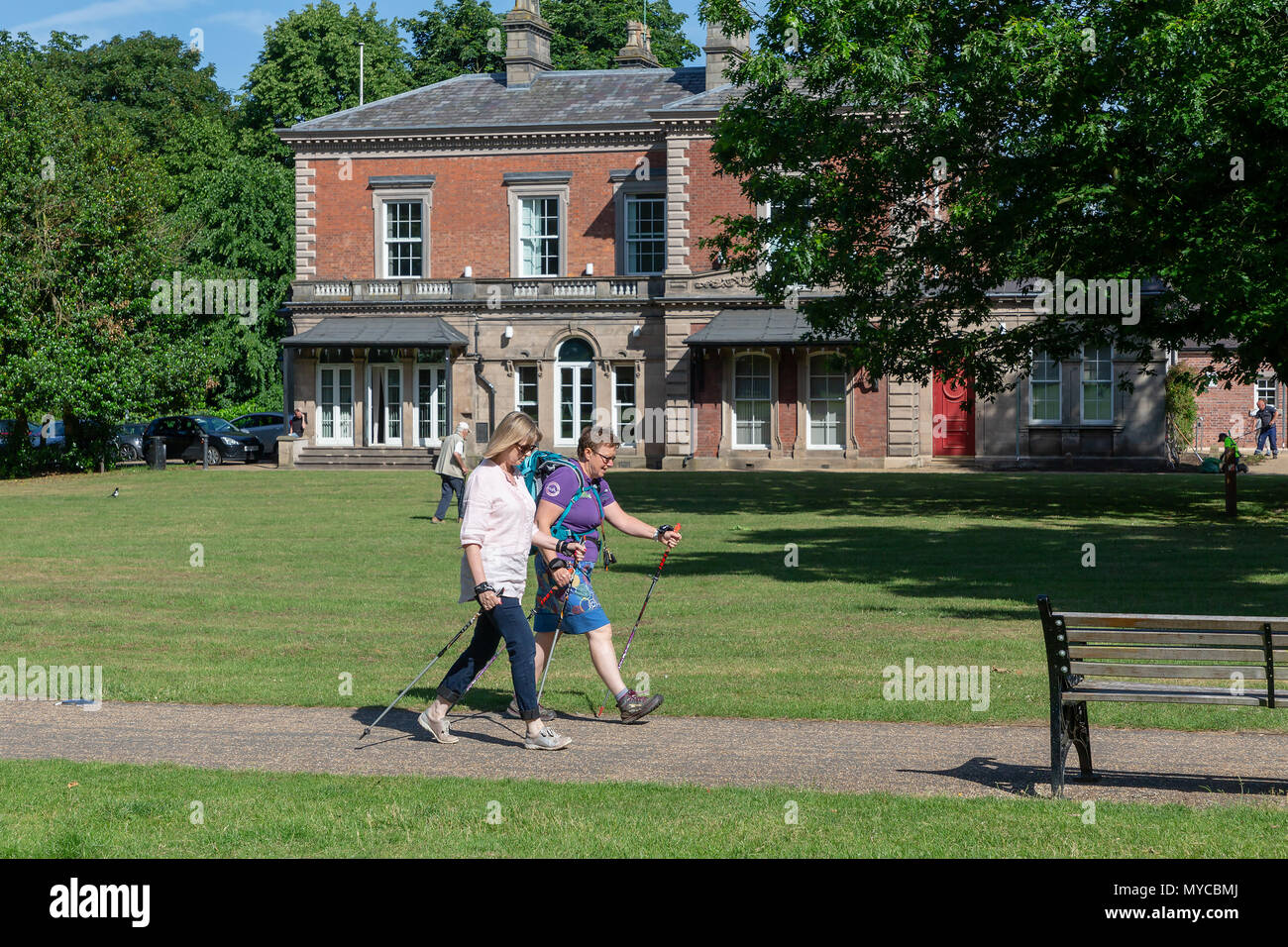 06 June 2018 - Two women practice Nordic walking along a path in the ... 06 June 2018 - Two women practice Nordic walking along a path in the ...