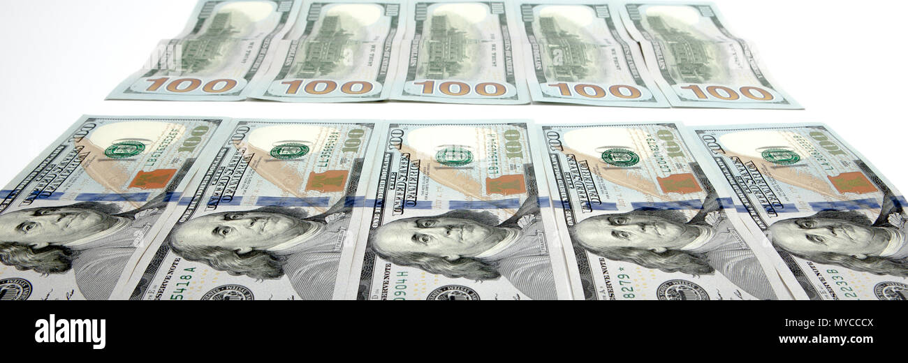 Large surface covered with US cash notes.High angle view of US hundred ...