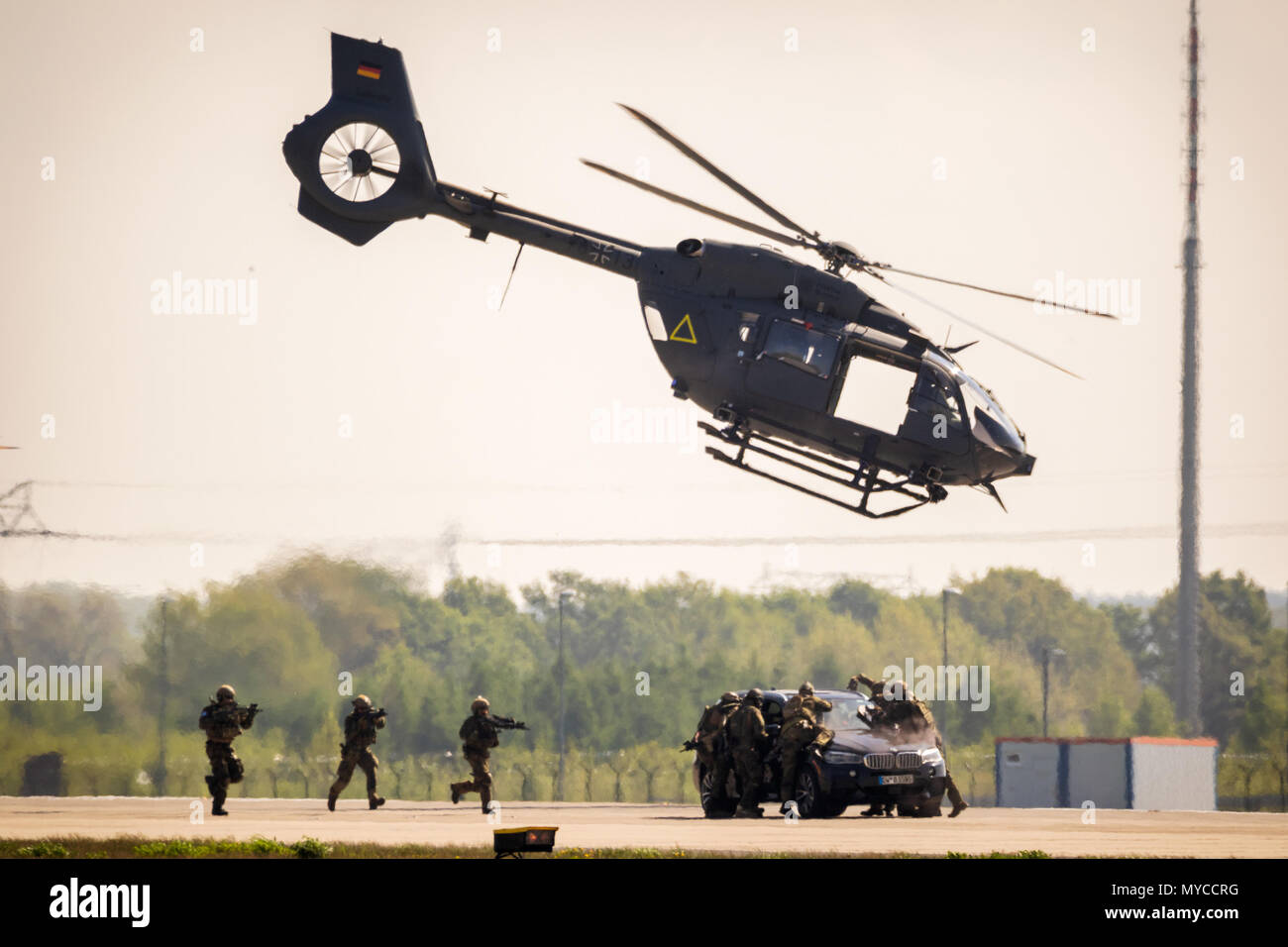 BERLIN, GERMANY - APR 27, 2018: German military H145M helicopter and special forces performing a ...