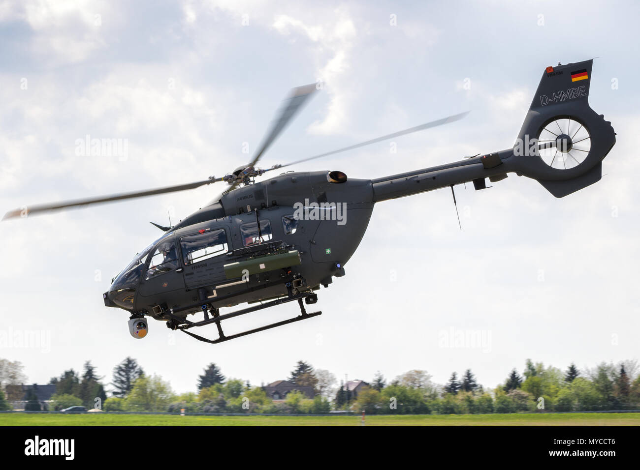 BERLIN - APR 27, 2018: New Airbus H145M military helicopter in flight at the Berlin ILA Air Show ...