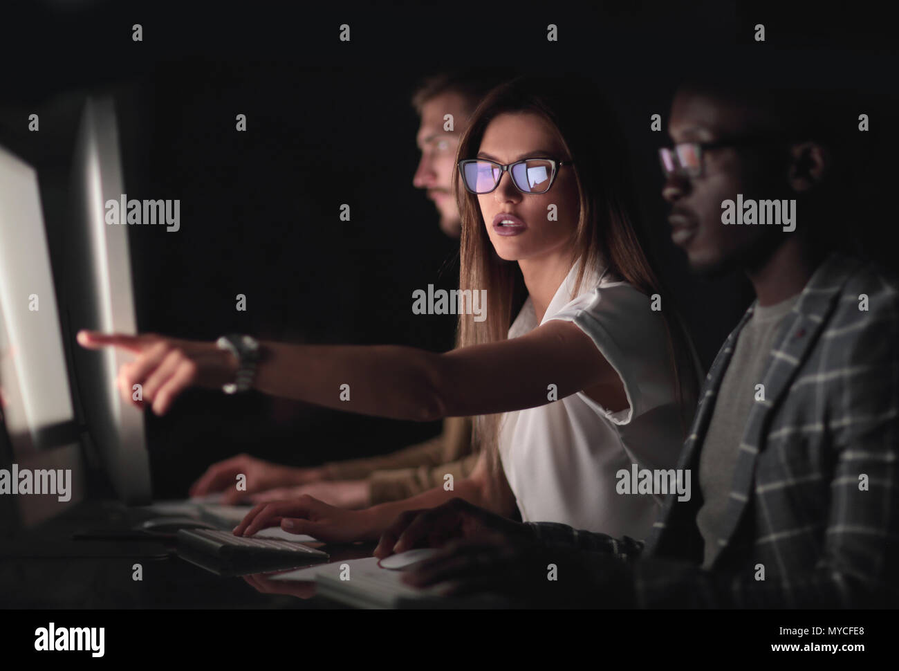 close up.a group of young people working on computers Stock Photo - Alamy