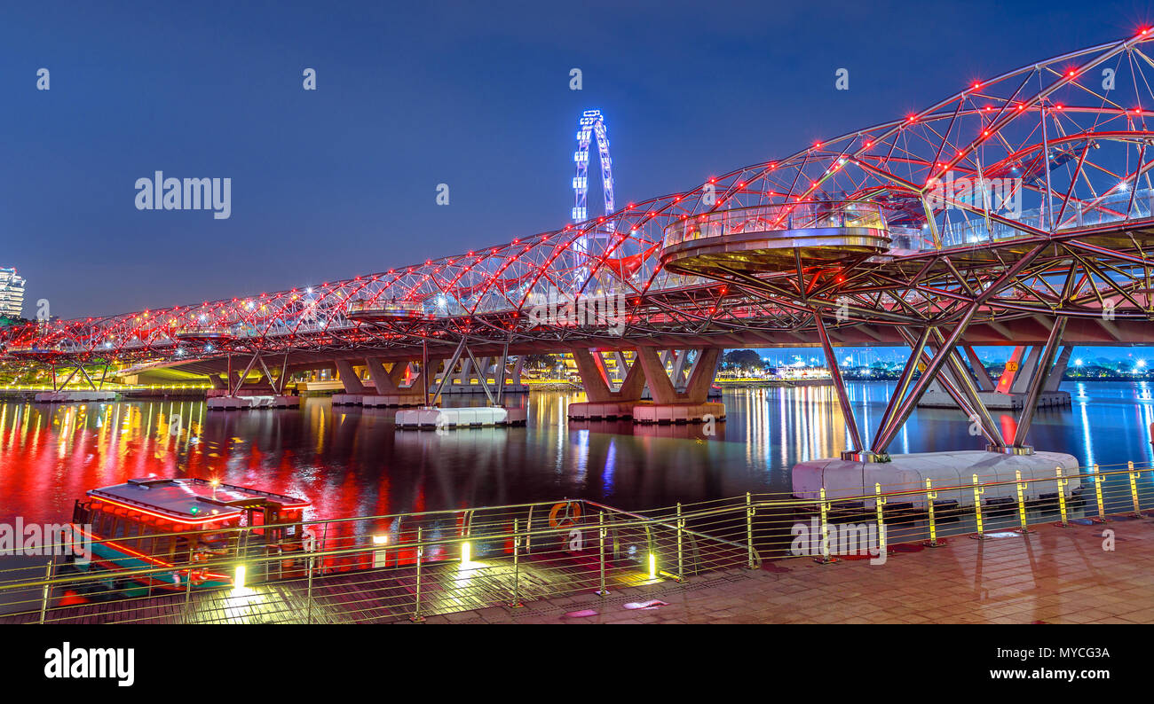 Architecture of pedestrian bridge, ferris wheel in the background ...