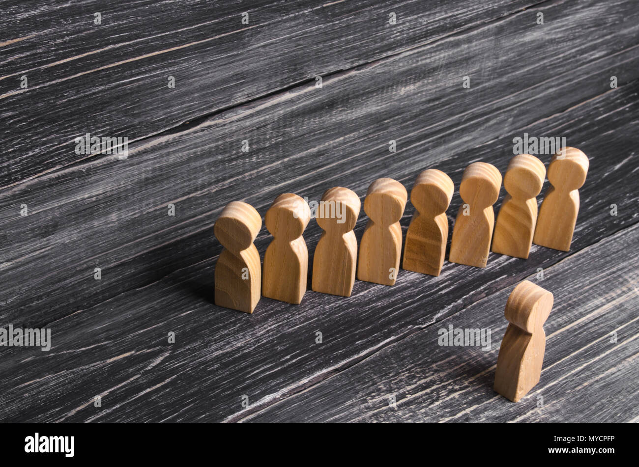 People stand in line at the briefing and wait for orders. Wooden ...