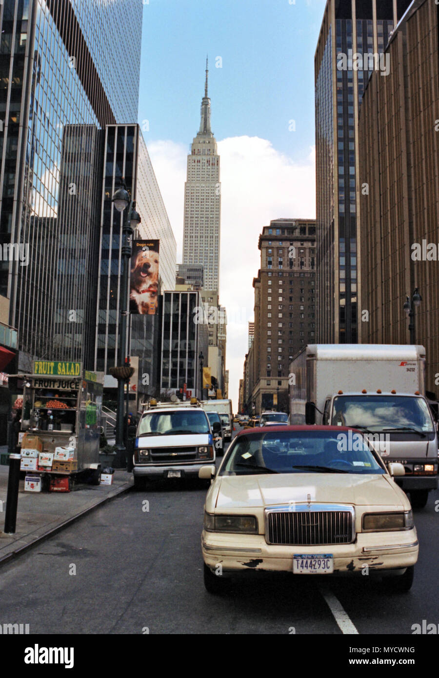 a typical street scene with cars in Manhattan, New York, with The ...