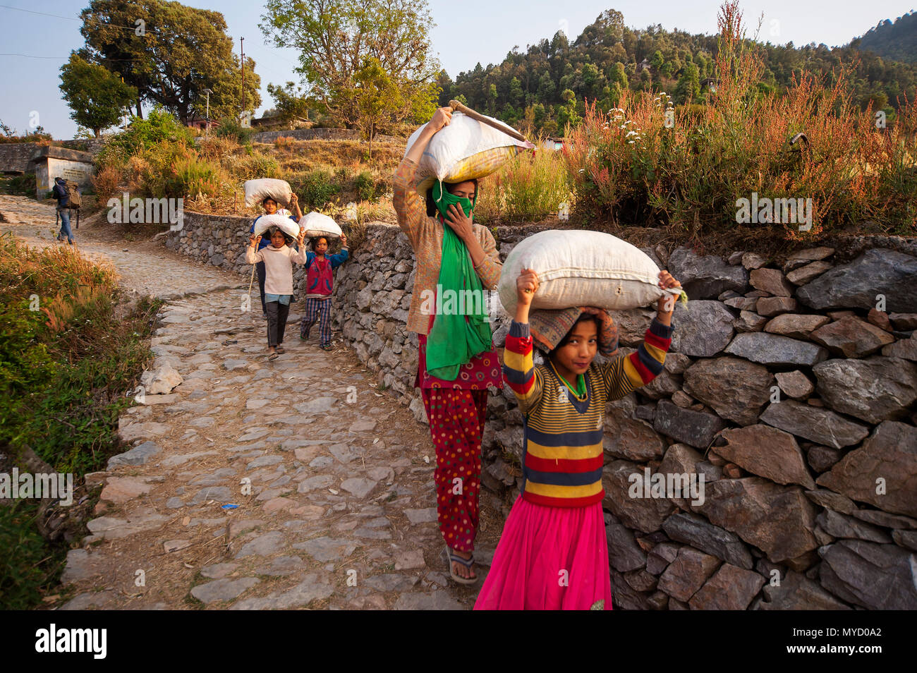 Indian people carrying suplies at Kala Agar village, Uttarakhand, India ...