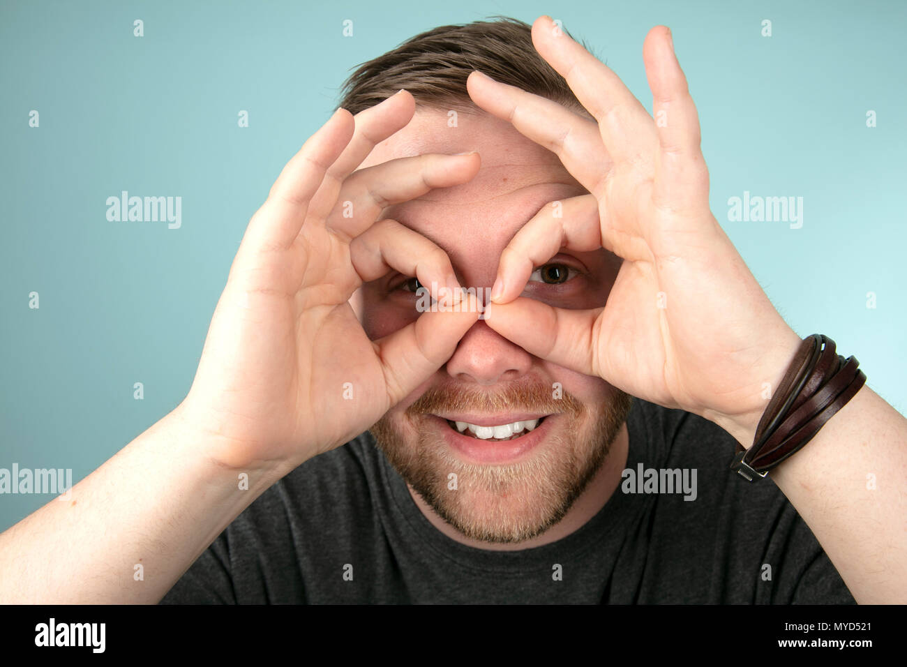 Fingers around eyes hi-res stock photography and images - Alamy