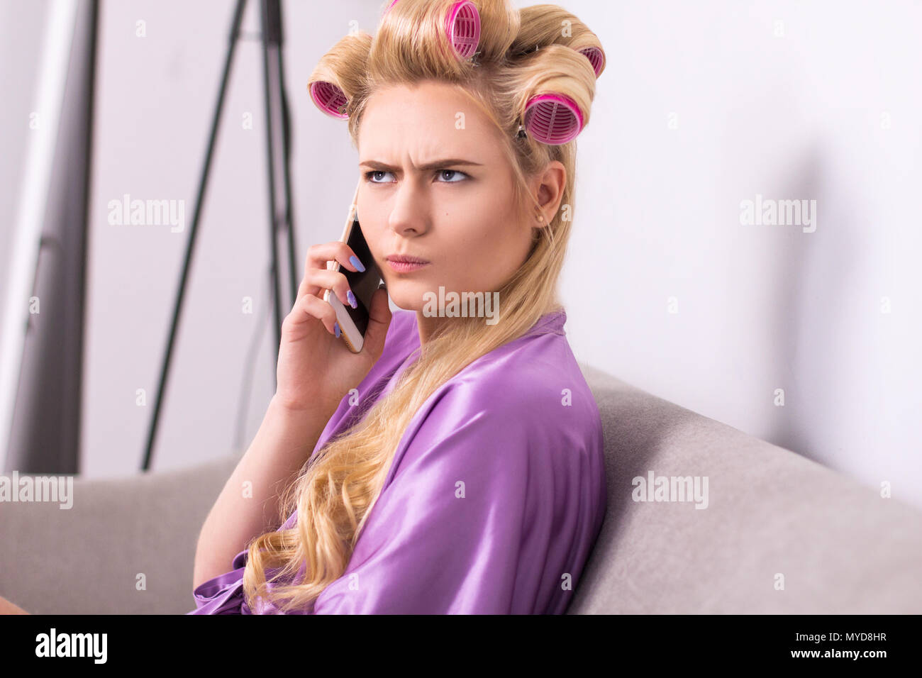 Young girl on her phone at home Stock Photo - Alamy