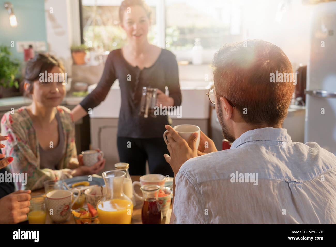 Women Sitting Around Kitchen Table High Resolution Stock Photography ...