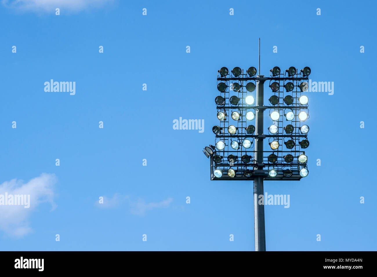 spotlight of stadium on blue sky background isolated Stock Photo - Alamy