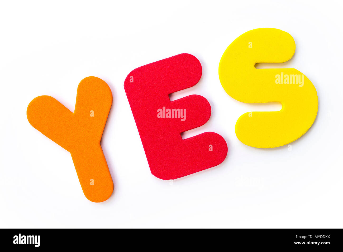 YES spelt out with coloured letters Stock Photo - Alamy
