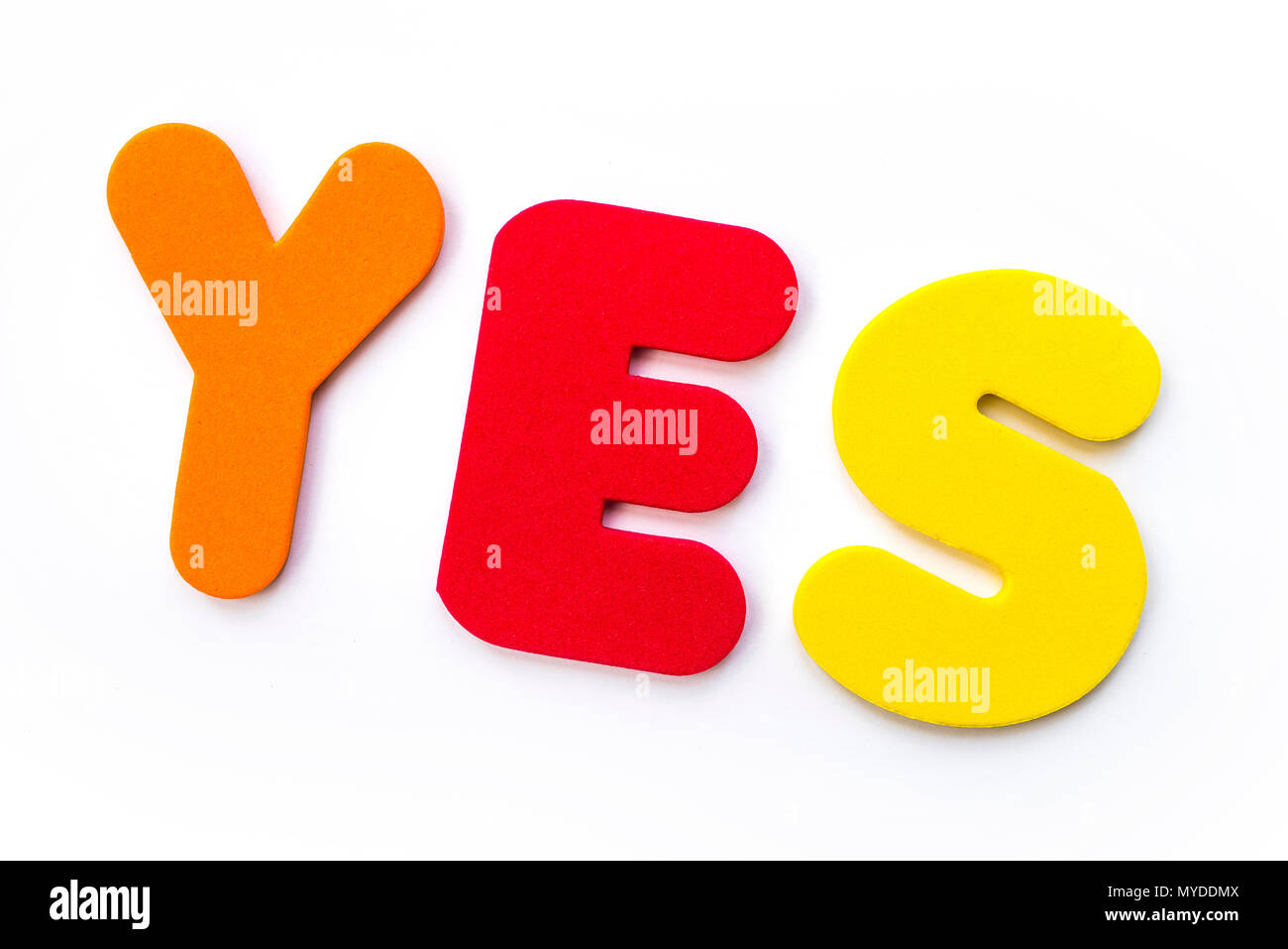 YES spelt out with coloured letters Stock Photo - Alamy