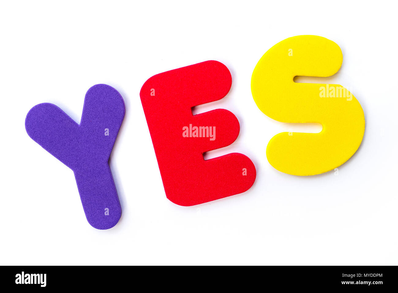 YES spelt out with coloured letters Stock Photo - Alamy