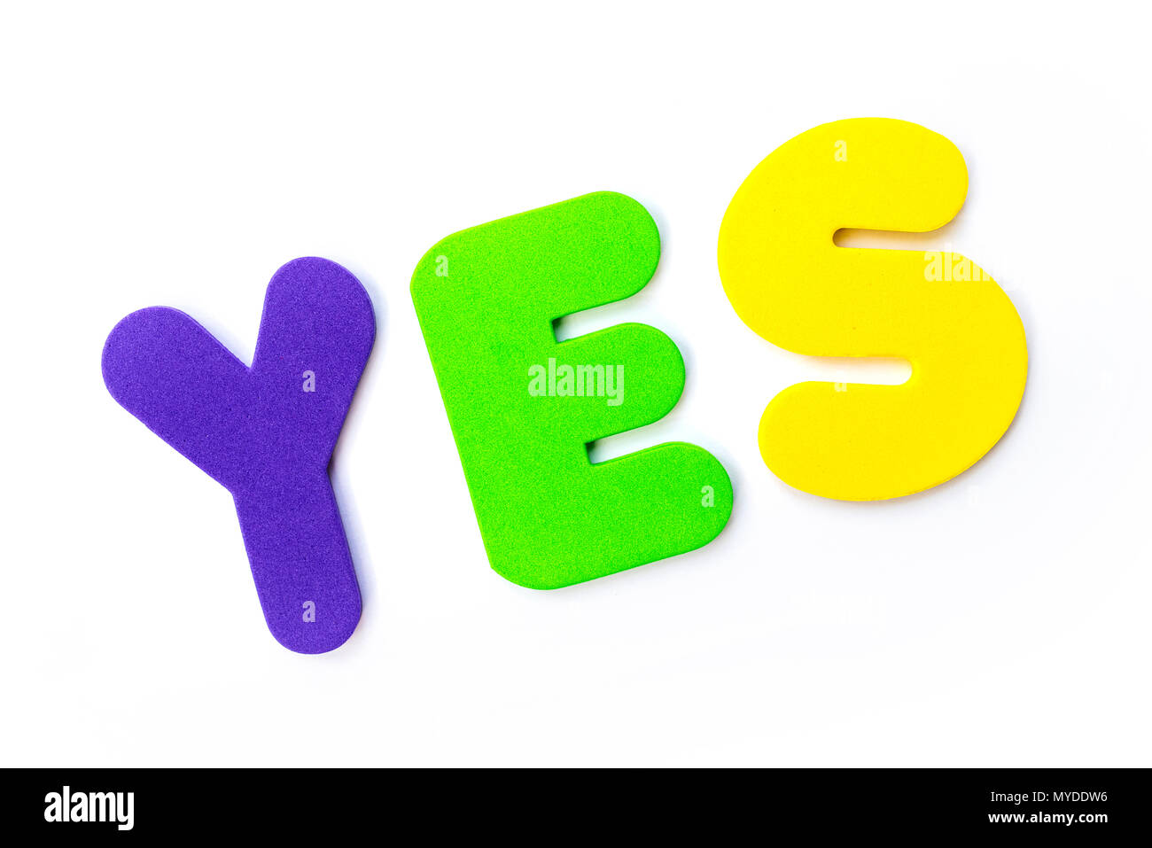YES spelt out with coloured letters Stock Photo - Alamy