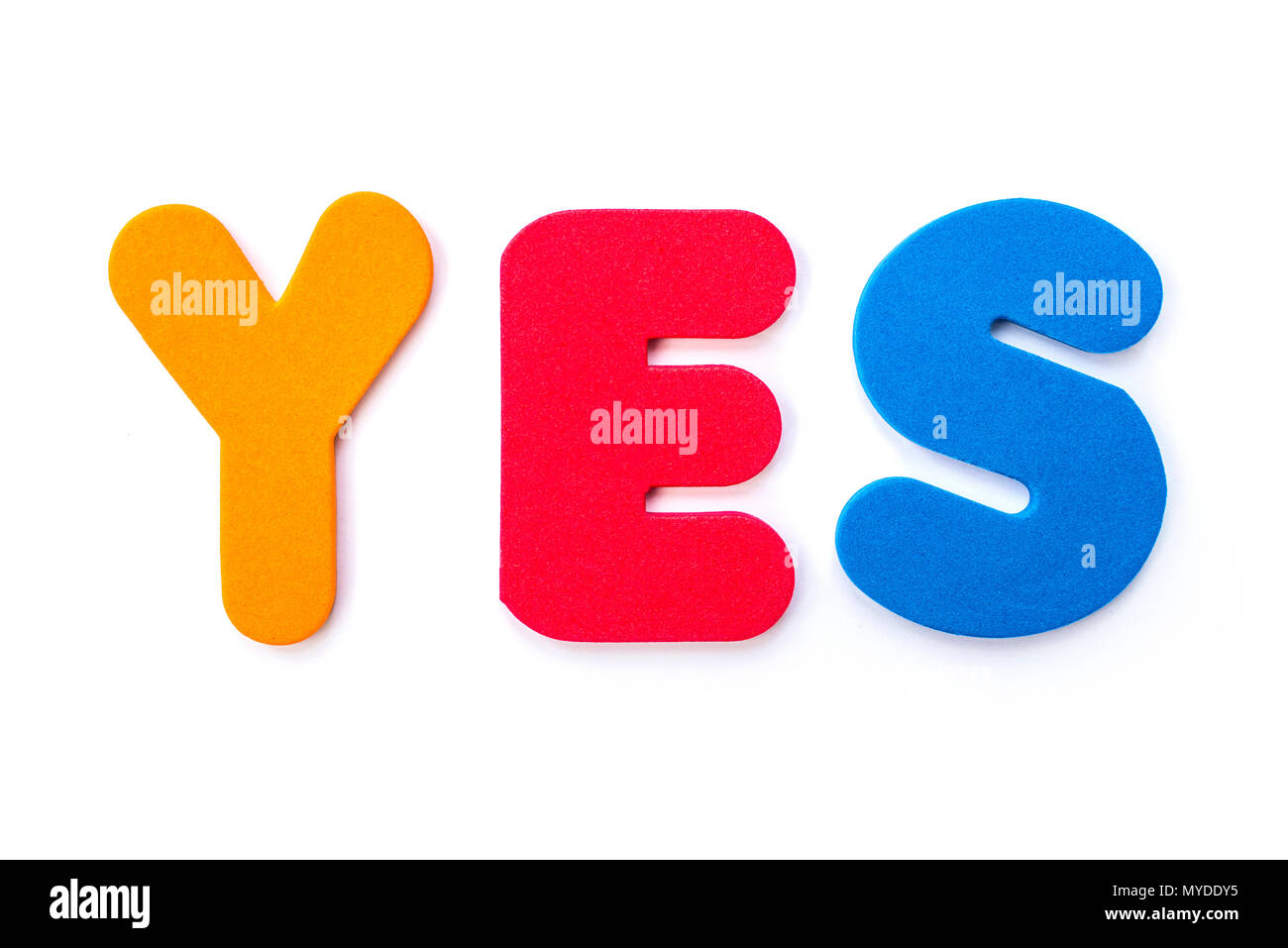 YES spelt out with coloured letters Stock Photo - Alamy