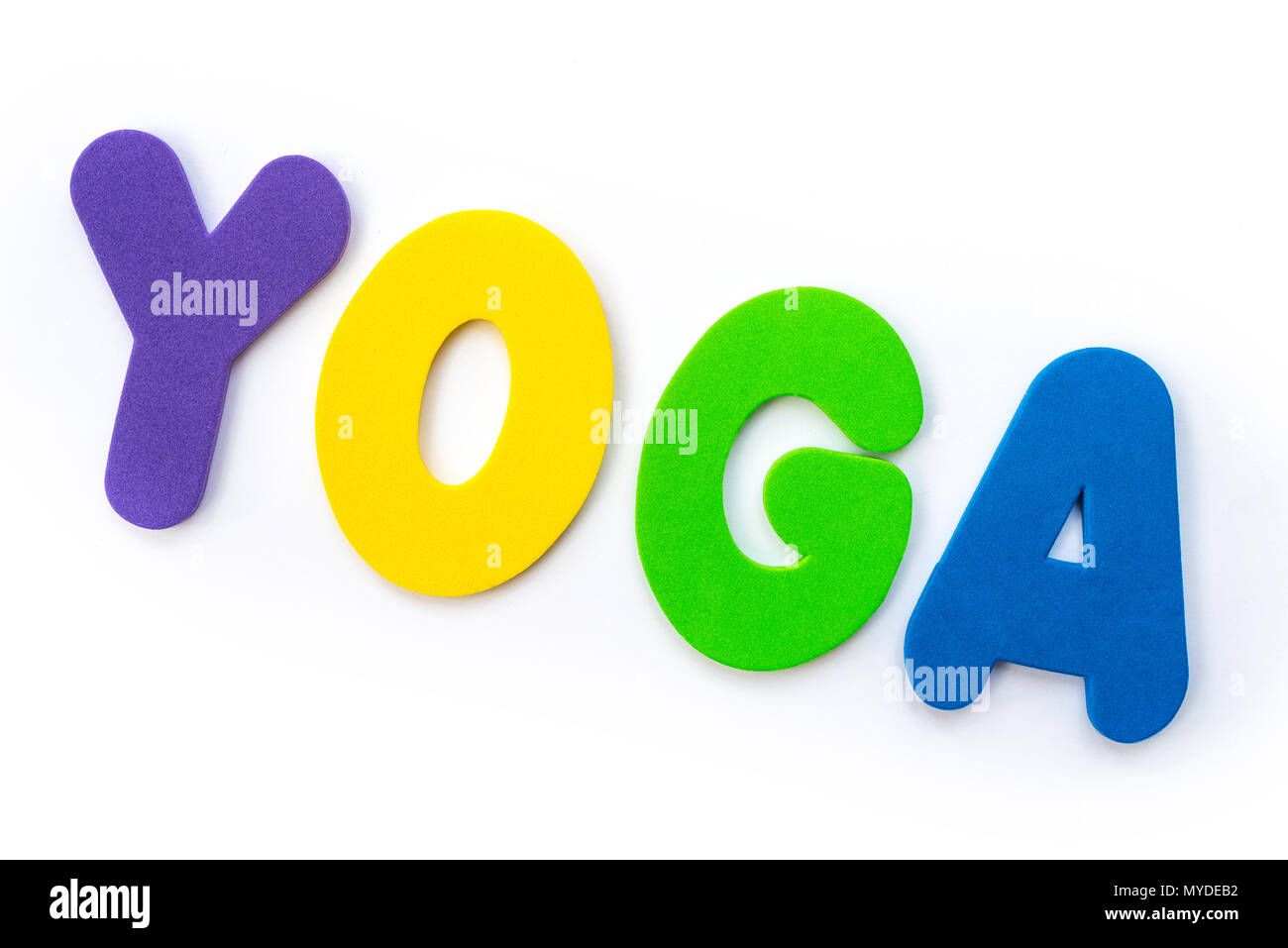 The word YOGA spelt out with coloured letters Stock Photo - Alamy