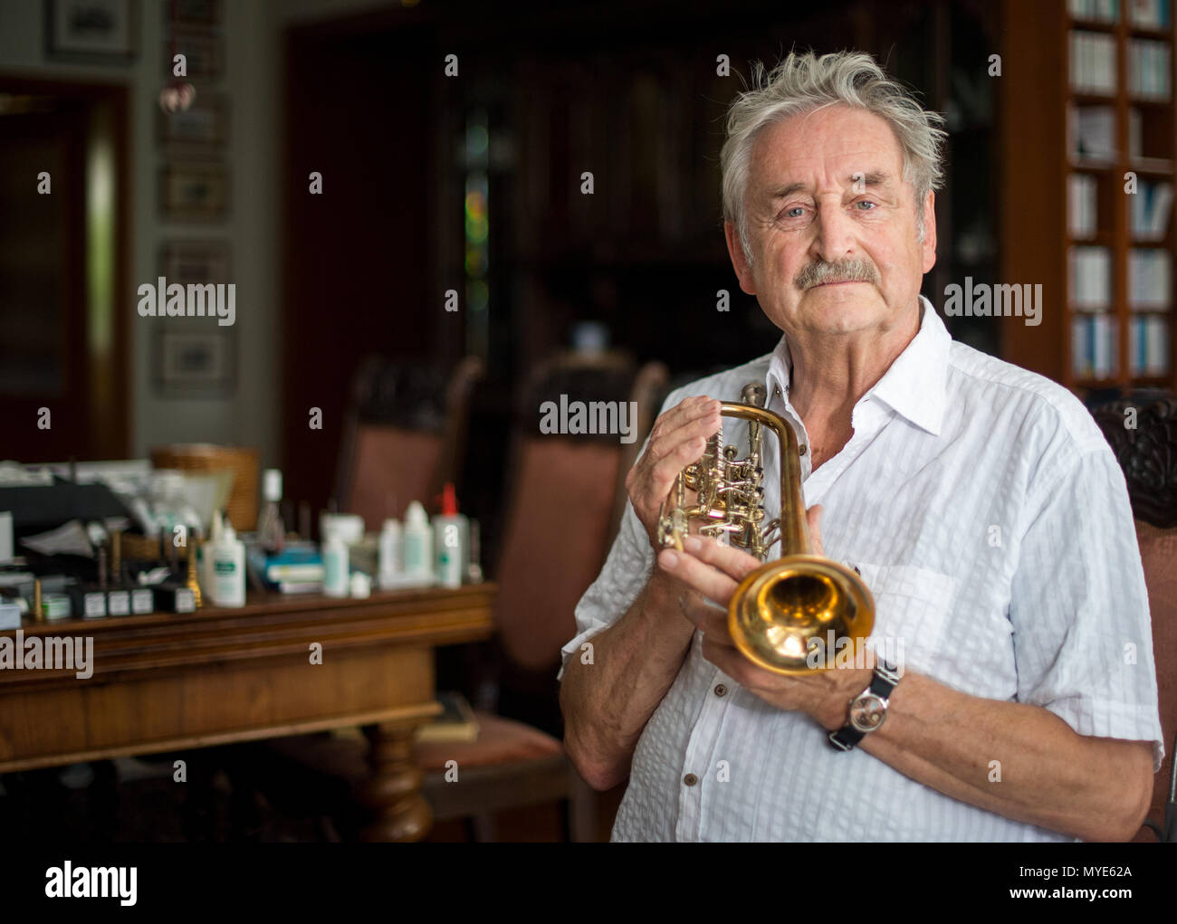 04 June 2018, Germany, Dresden: The trumpeter Ludwig Guettler sits in ...