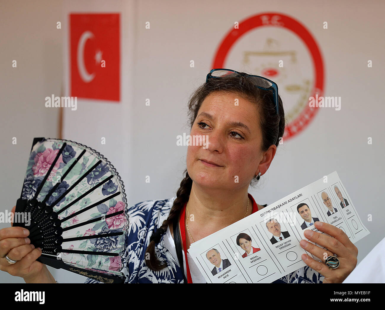 7 June 2018, Huerth, Germany: A Turkish election worker poses with a ...