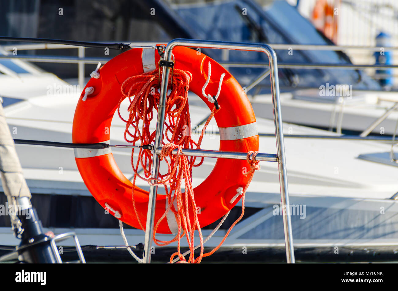 Orange lifebuoy on the side of the boat, an essential tool life-saving ...
