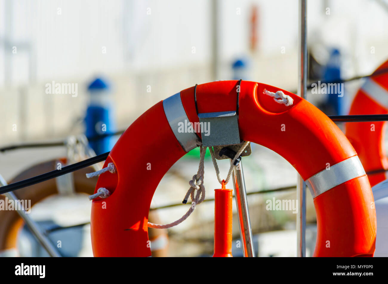 Orange lifebuoy on the side of the boat, an essential tool life-saving ...