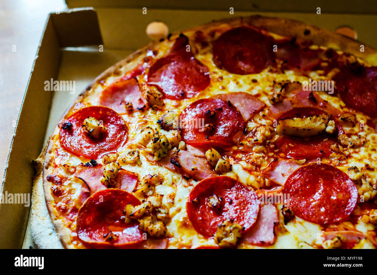 Delicious pizza in cardboard, pizza delivered to your home in a special ...