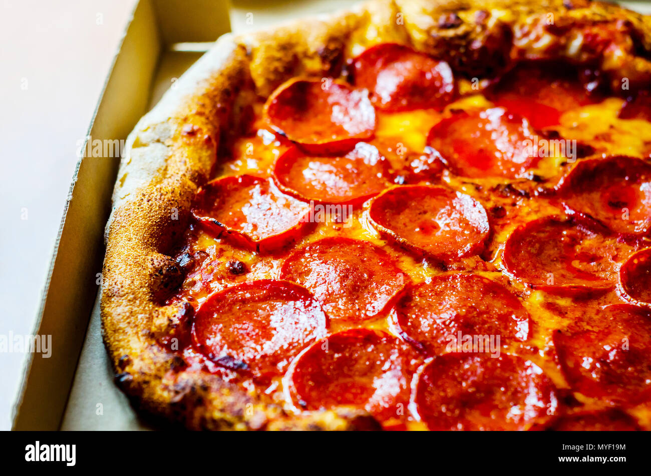 Delicious pizza in cardboard, pizza delivered to your home in a special ...