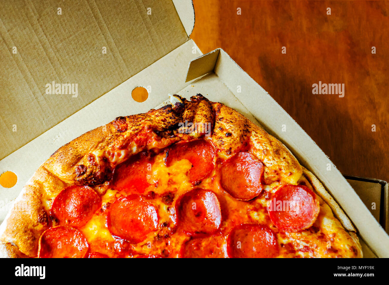 Delicious pizza in cardboard, pizza delivered to your home in a special ...